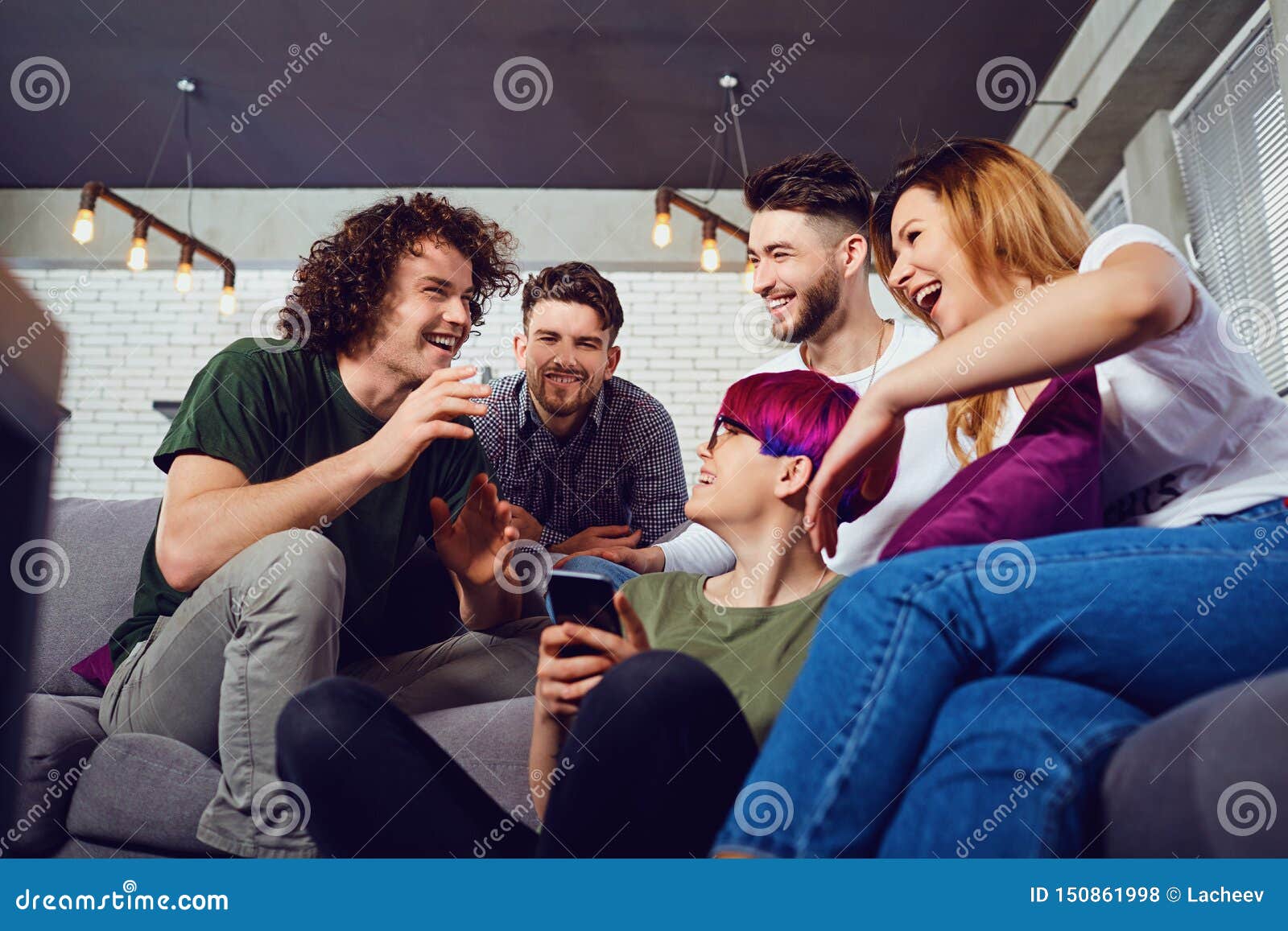 A Group of Friends at a Meeting Talking Together in the Room. Stock ...