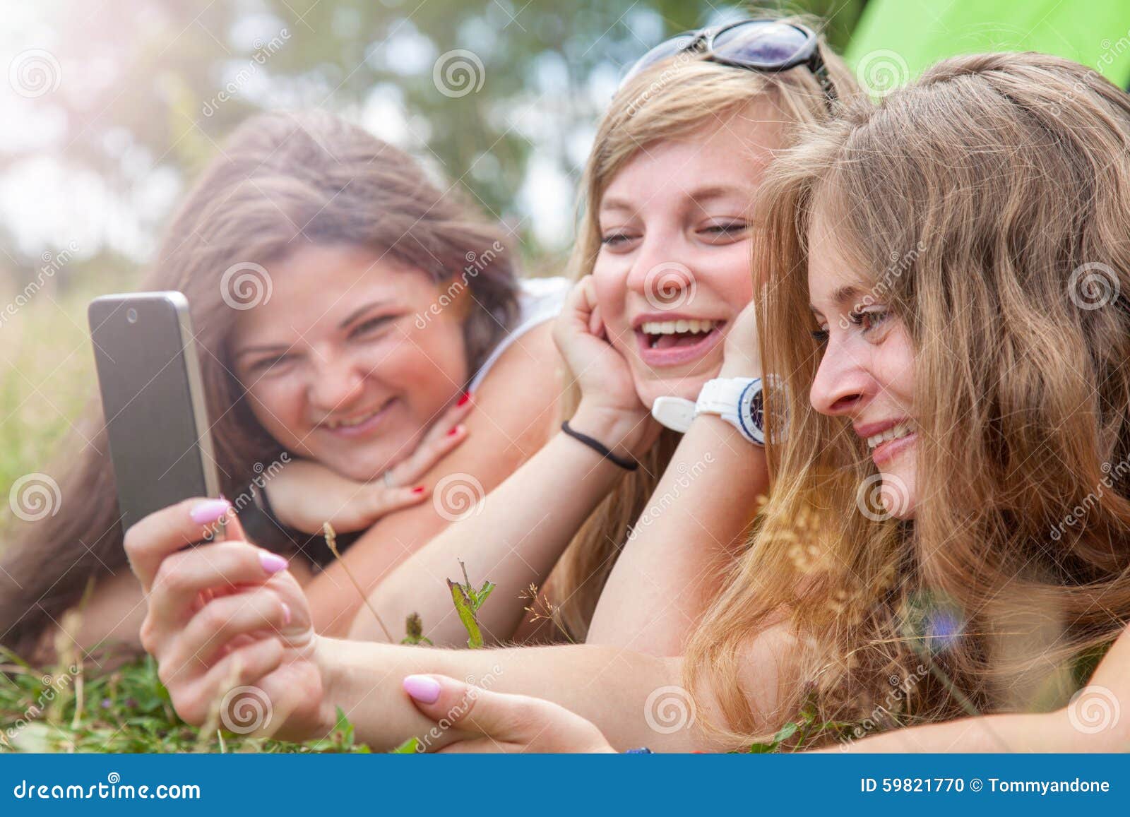 Group of Friends Outdoors with a Smart Phone Stock Photo - Image of ...