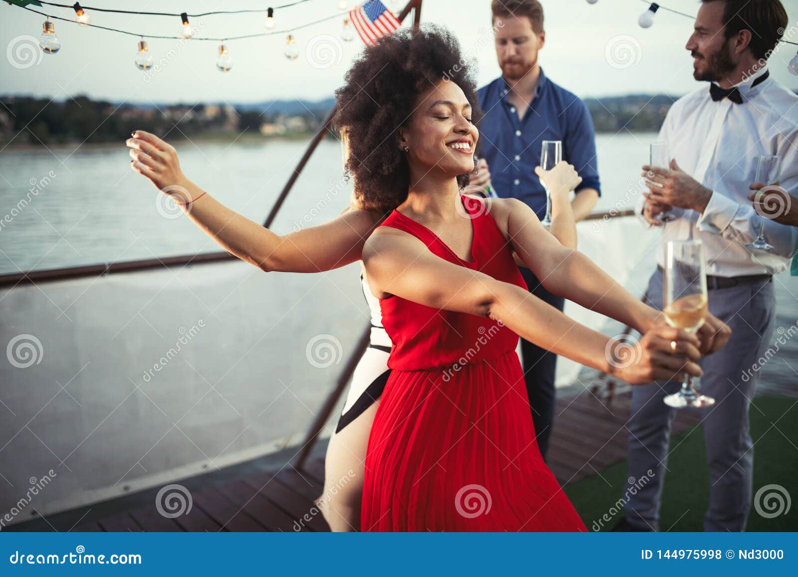Group of Friends at Party Dancing and Smiling Together Stock Photo ...