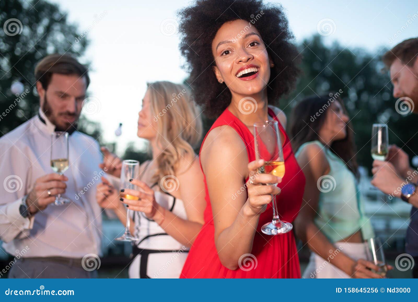 Group of Friends at Party Dancing and Smiling Together Stock Photo ...