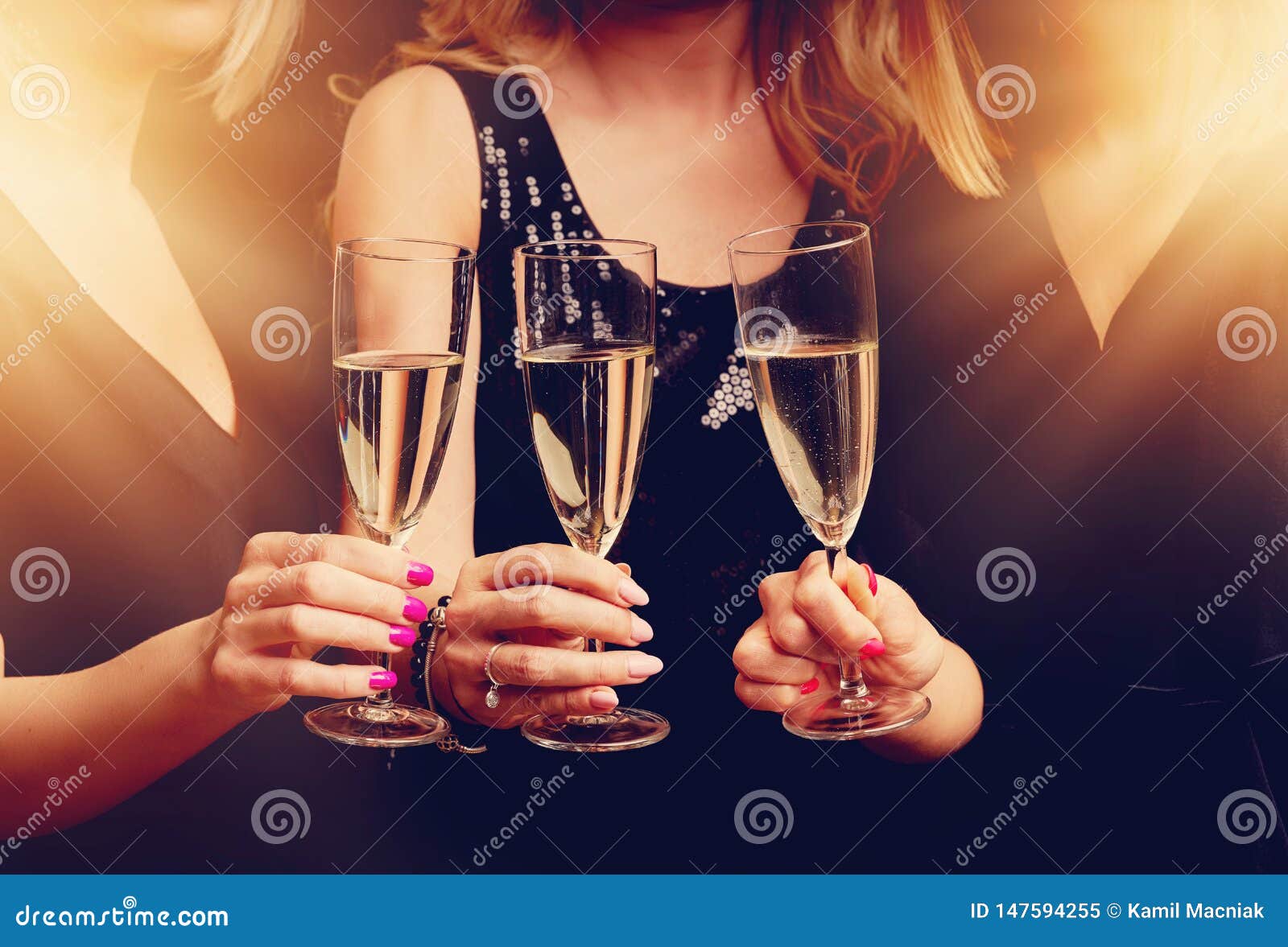Group Of Friends Partying In A Nightclub And Toasting Drinks Stock