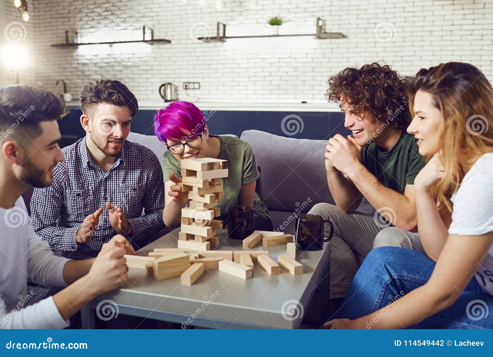 A Group of Friends Play Board Games in the Room. Stock Photo - Image of ...