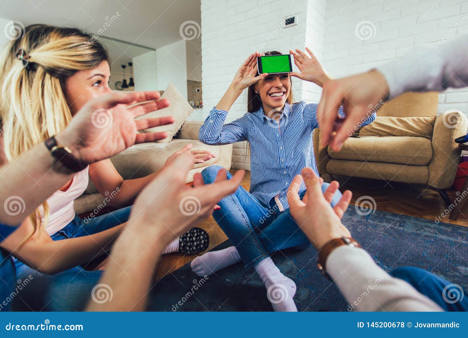 Group of Friends Playing Charades at Home Stock Photo - Image of couple ...