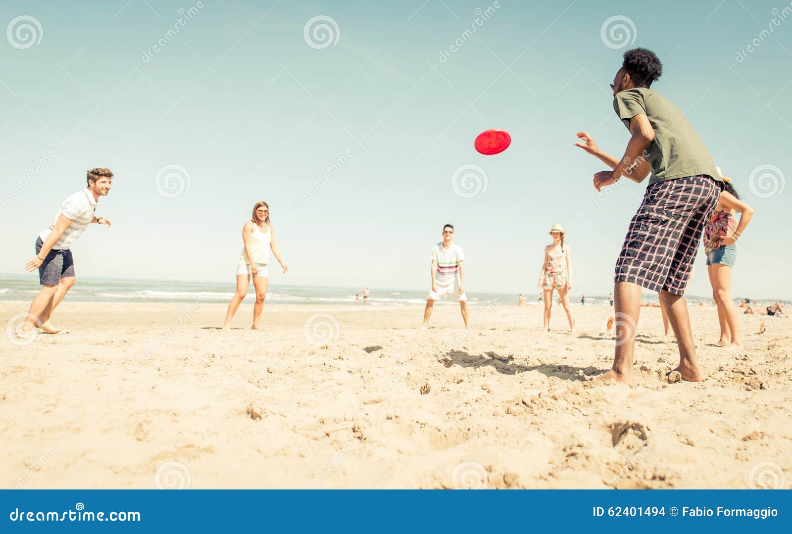 Group Of Friends Playing With Frisbee Stock Photo - Image: 62401494