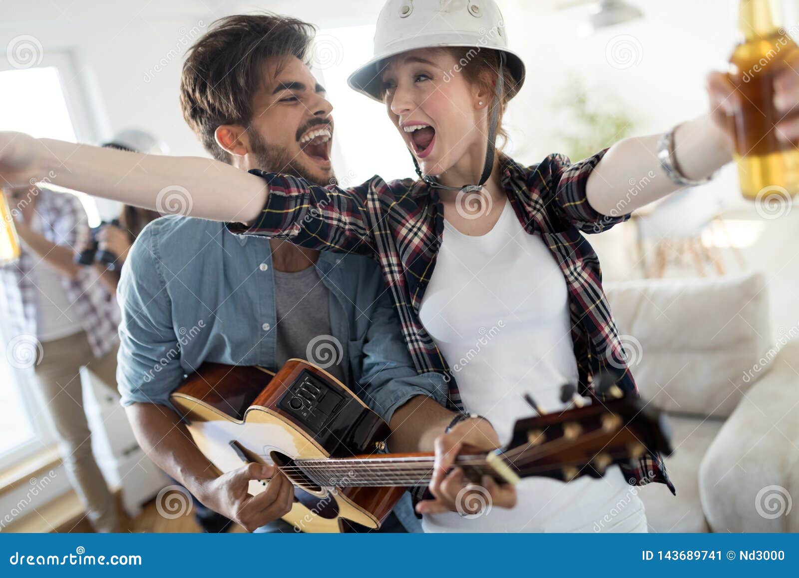 Group of Friends Playing Guitar and Partying at Home Stock Image ...