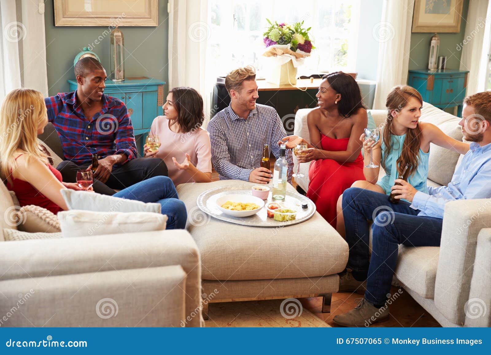 Group of Friends Relaxing at Home with Drinks Together Stock Image ...