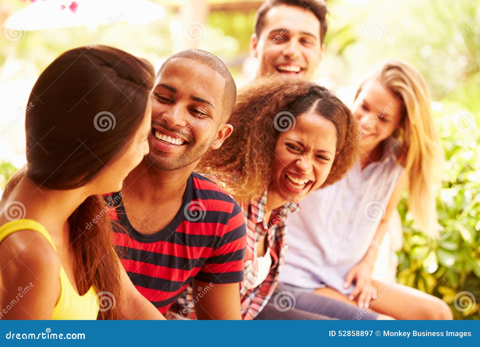 Group of Friends Relaxing Outdoors on Holiday Together Stock Image ...