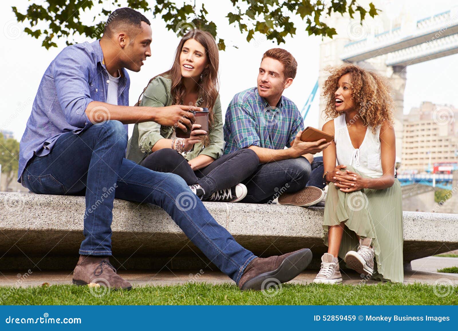 Group of Friends Relaxing by Tower Bridge in London Stock Image - Image ...