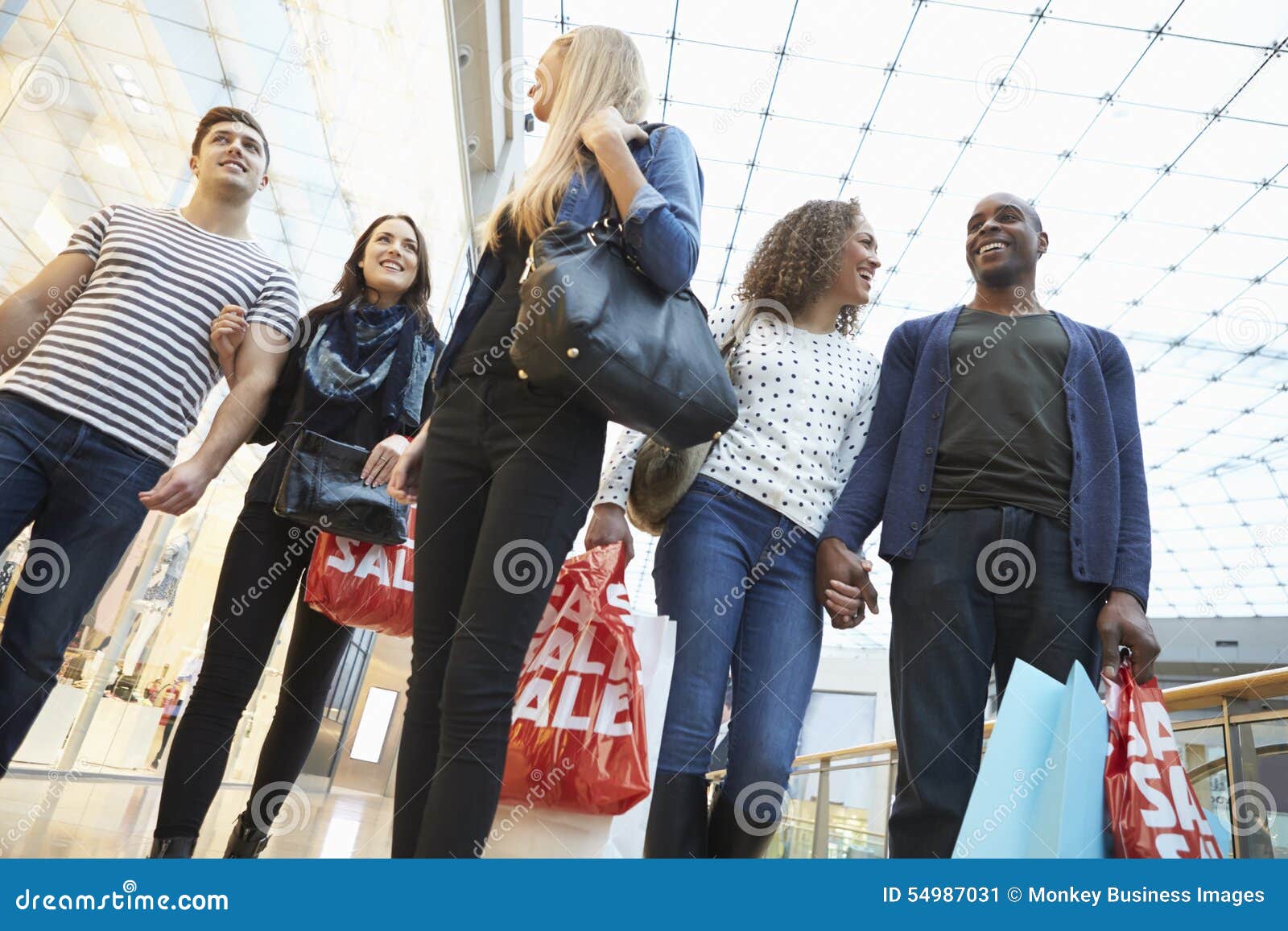 Group of Friends Shopping in Mall Together Stock Image - Image of ...