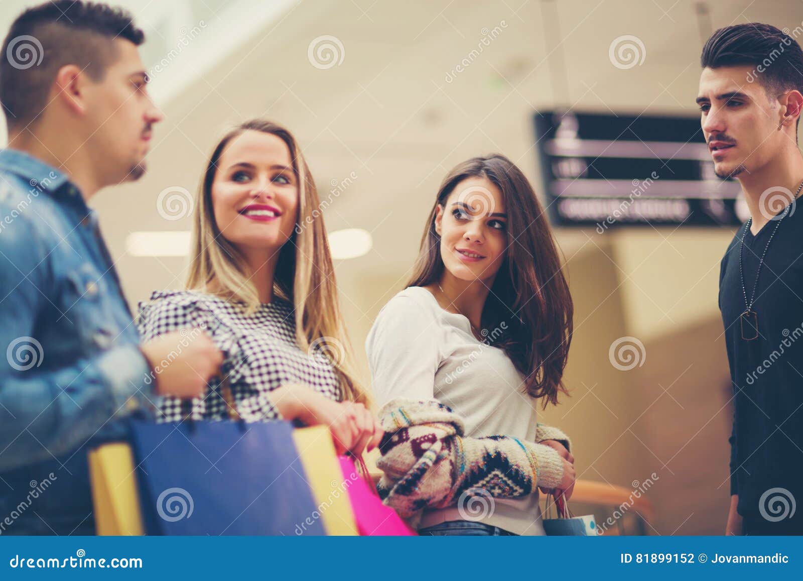 Group of Friends Shopping in Mall Together Stock Photo - Image of ...