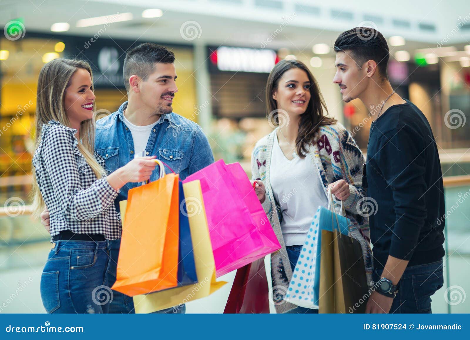 Group of Friends Shopping in Mall Together Stock Photo - Image of ...