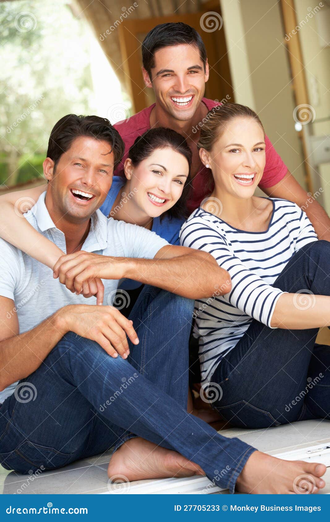 Group of Friends Sitting Outside House Stock Image - Image of thirties ...