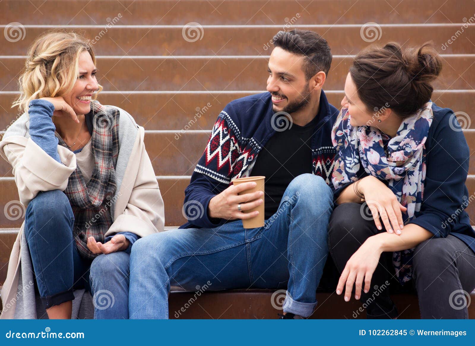 Group of Friends Sitting Outside on Stairs Stock Image - Image of ...