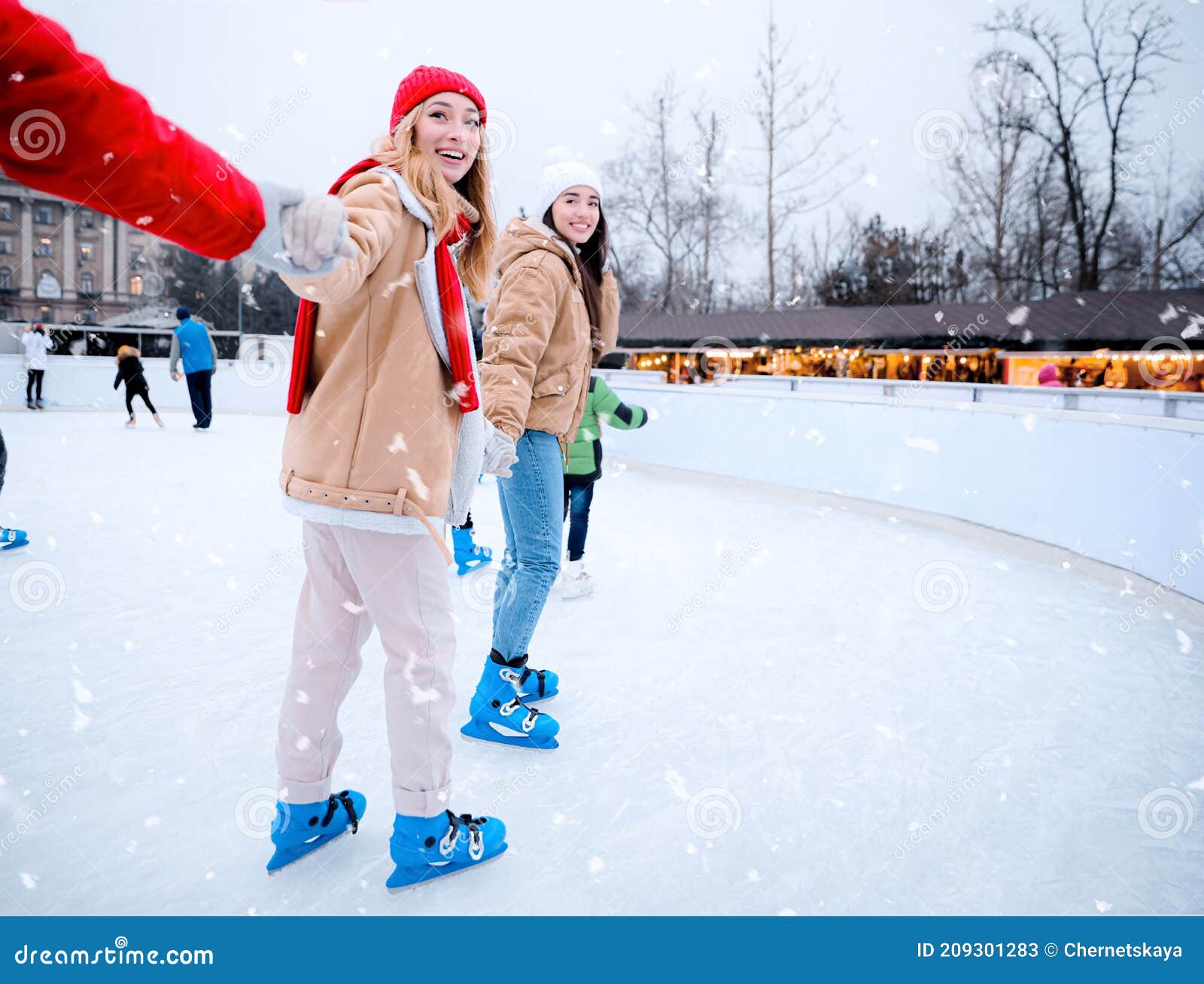 Group of Friends Skating at Outdoor Ice Rink Stock Image - Image of ...