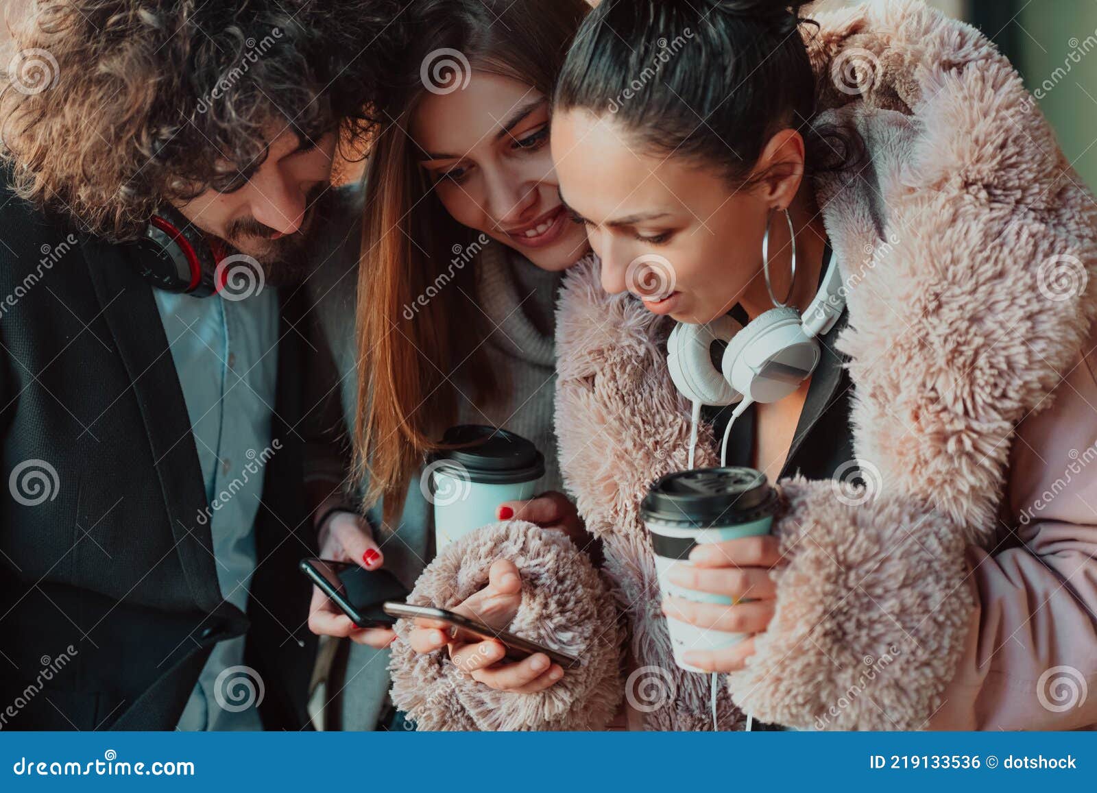 Group Friends Stand in Front of the University and Use a Smartphone ...
