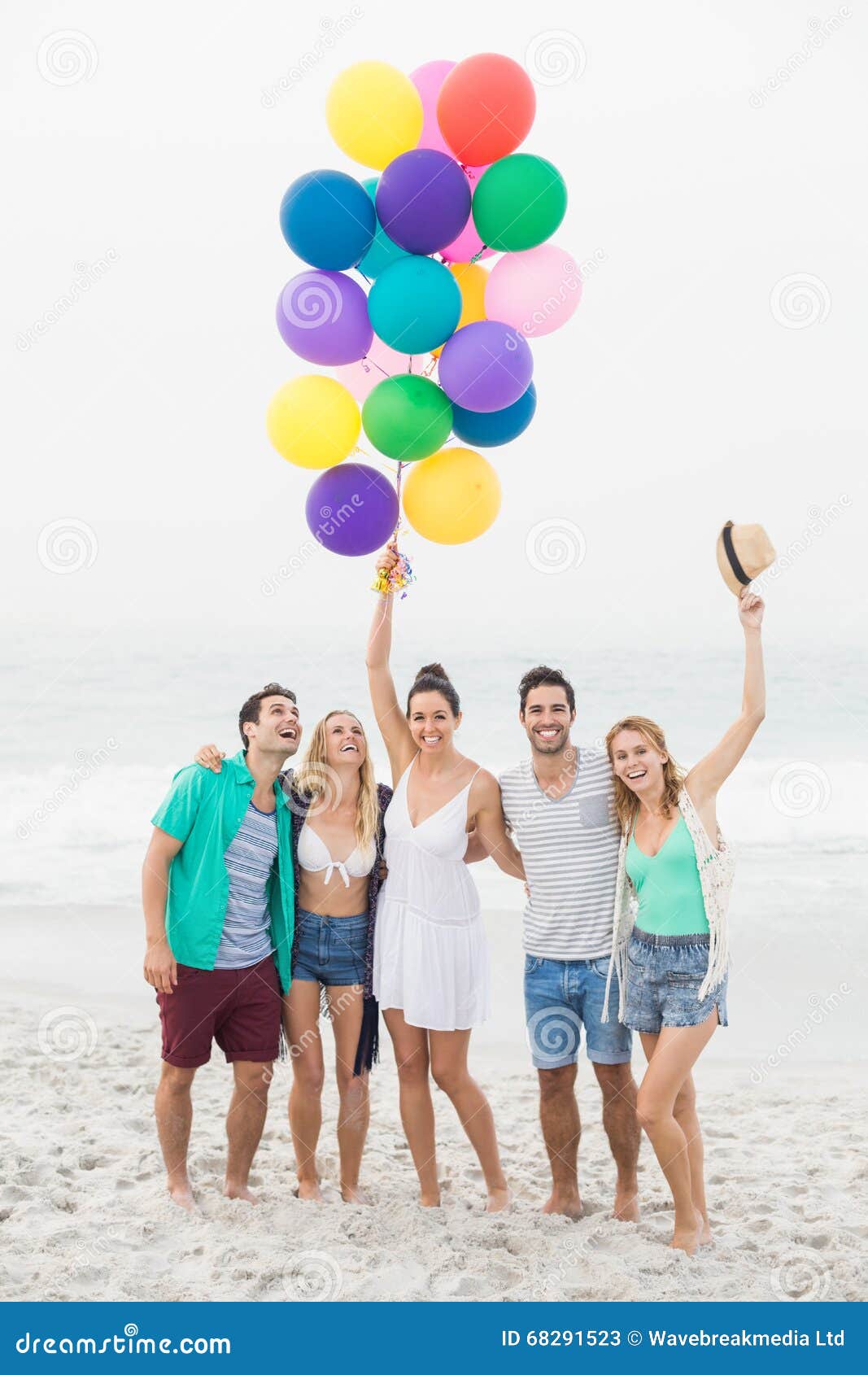 Group of Friends Standing on the Beach with Balloons Stock Image ...