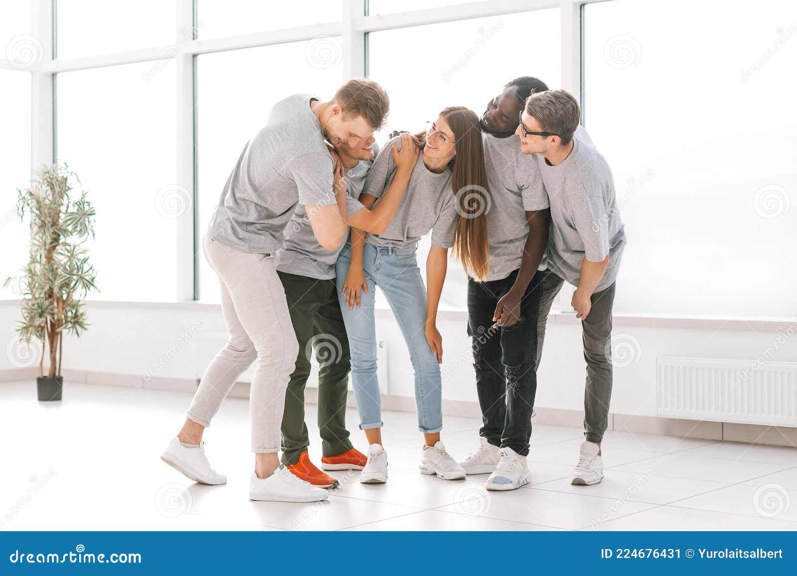 Group of Friends Standing in a Bright Spacious Hall Stock Image - Image ...