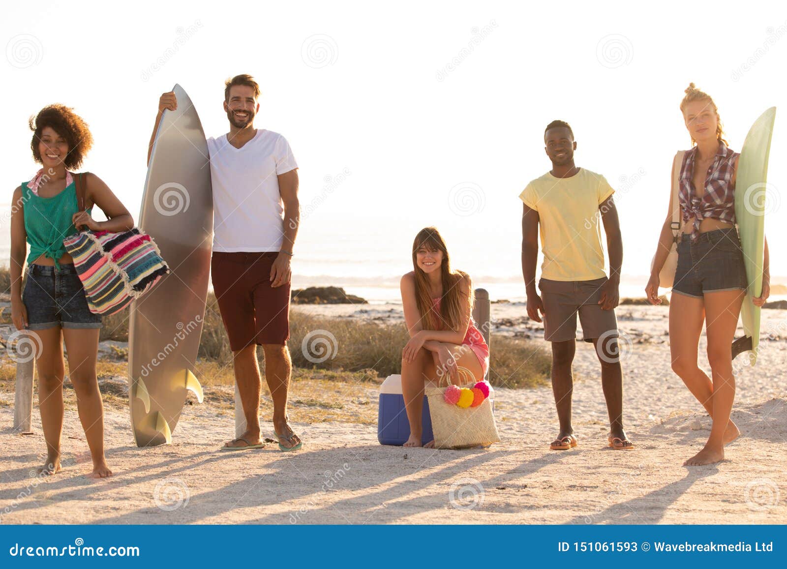 Group of Friends Standing and Looking at Camera at Beach on a Sunny Day ...