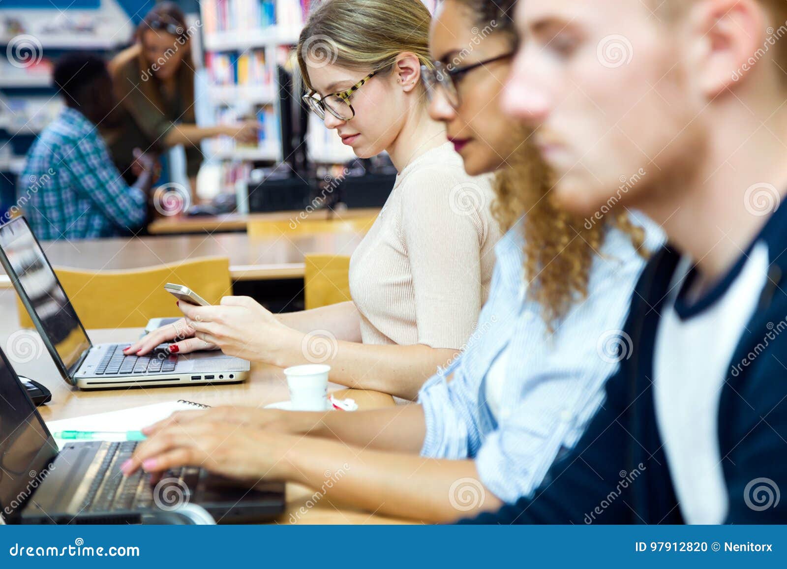 Group of Friends Studying in a University Library. Stock Photo - Image ...