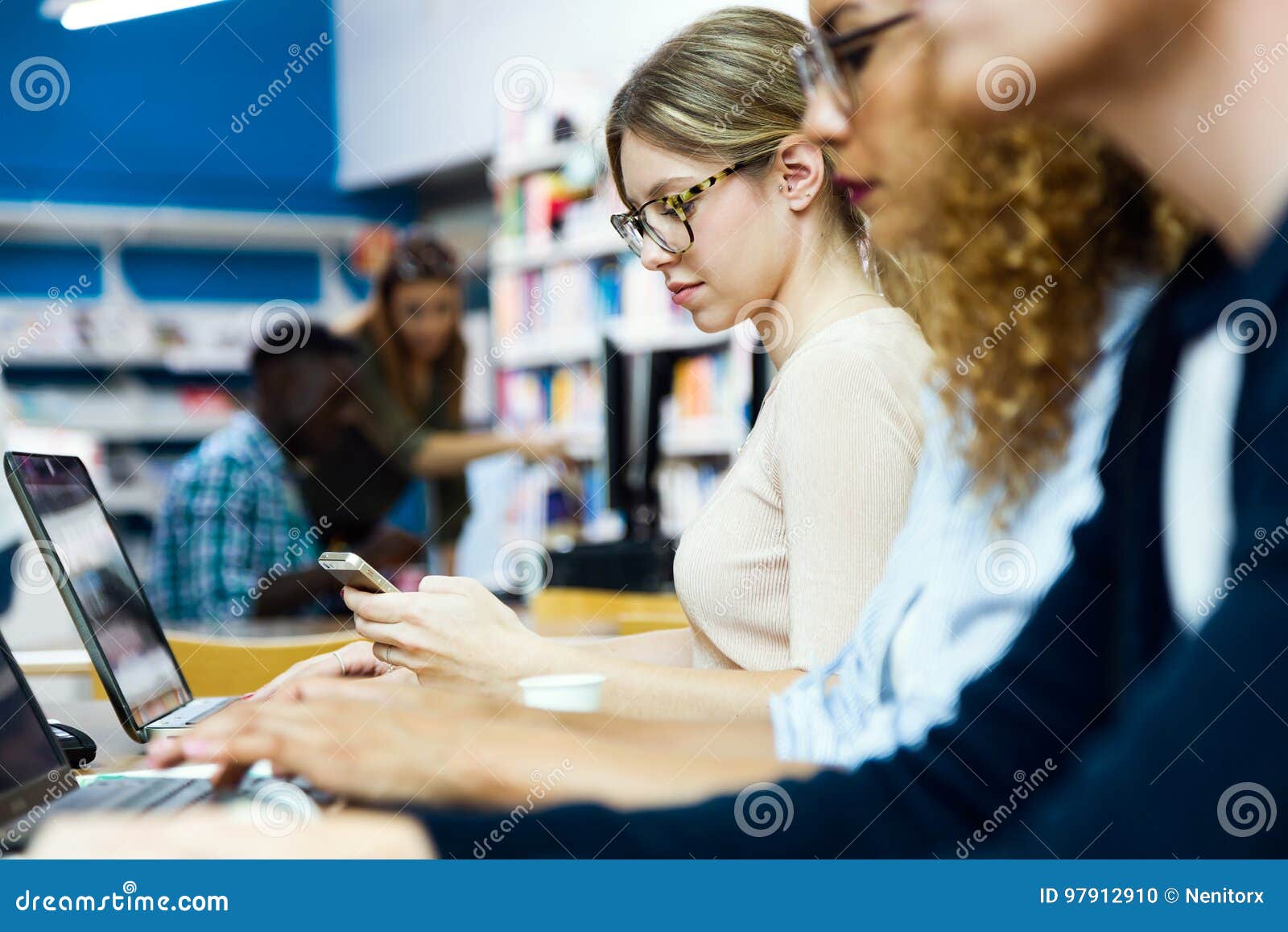 Group of Friends Studying in a University Library. Stock Photo - Image ...