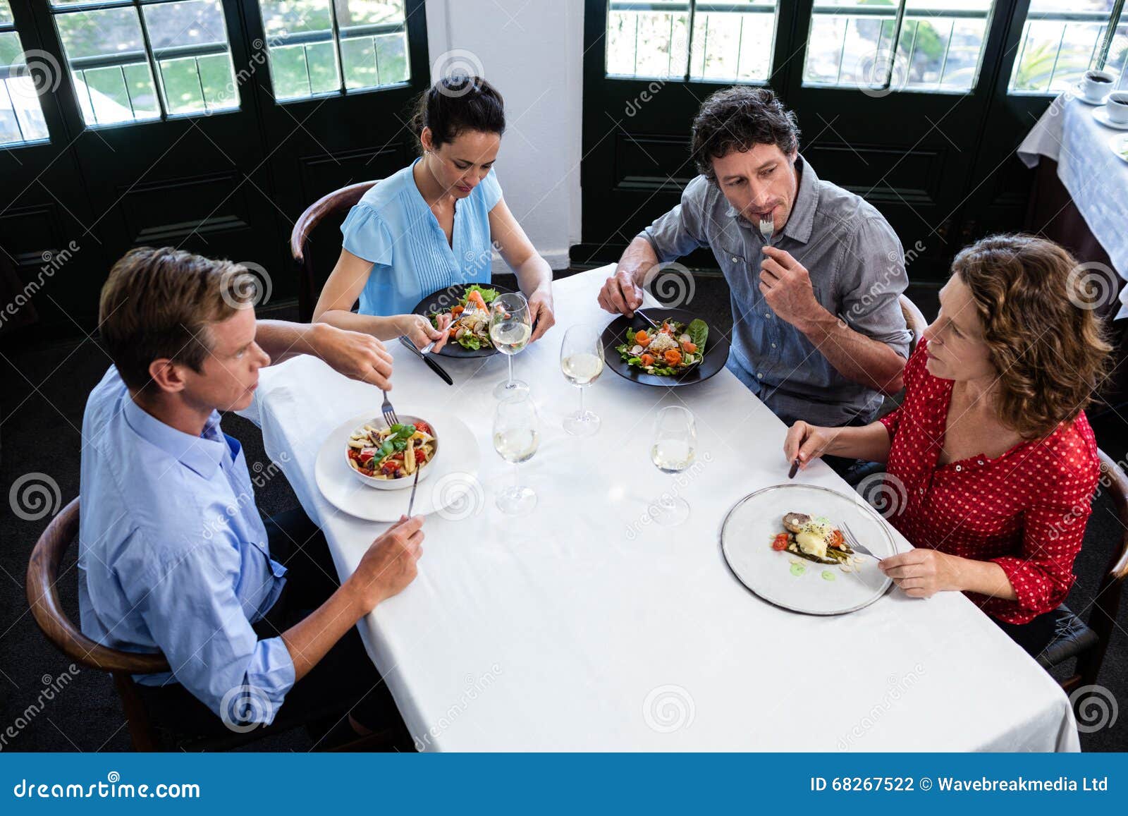 Group of Friends Talking while Having Lunch Stock Photo - Image of ...