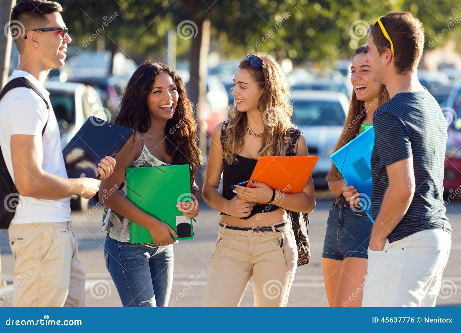 A Group of Friends Talking in the Street after Class Stock Photo ...