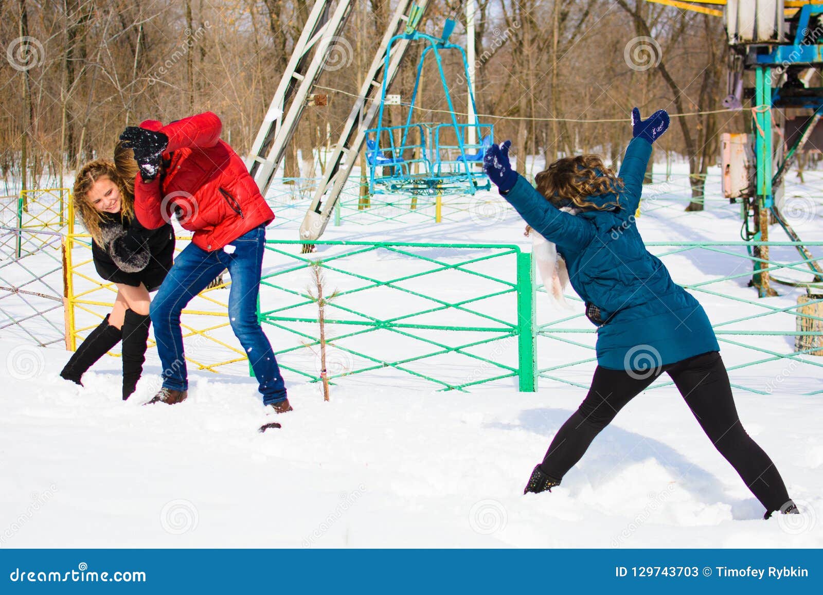 A Group of Friends Throw Snowballs at Each Other Stock Image - Image of ...