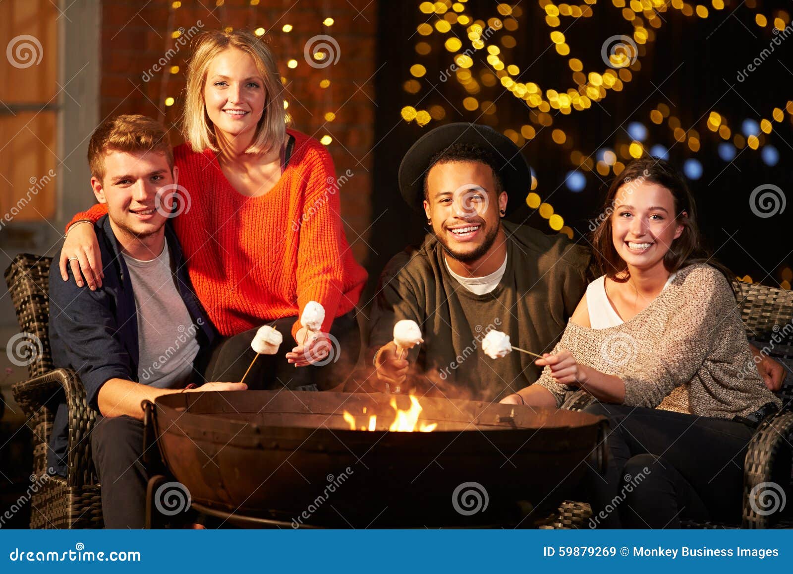 Group of Friends Toasting Marshmallows by Firepit Stock Image - Image ...
