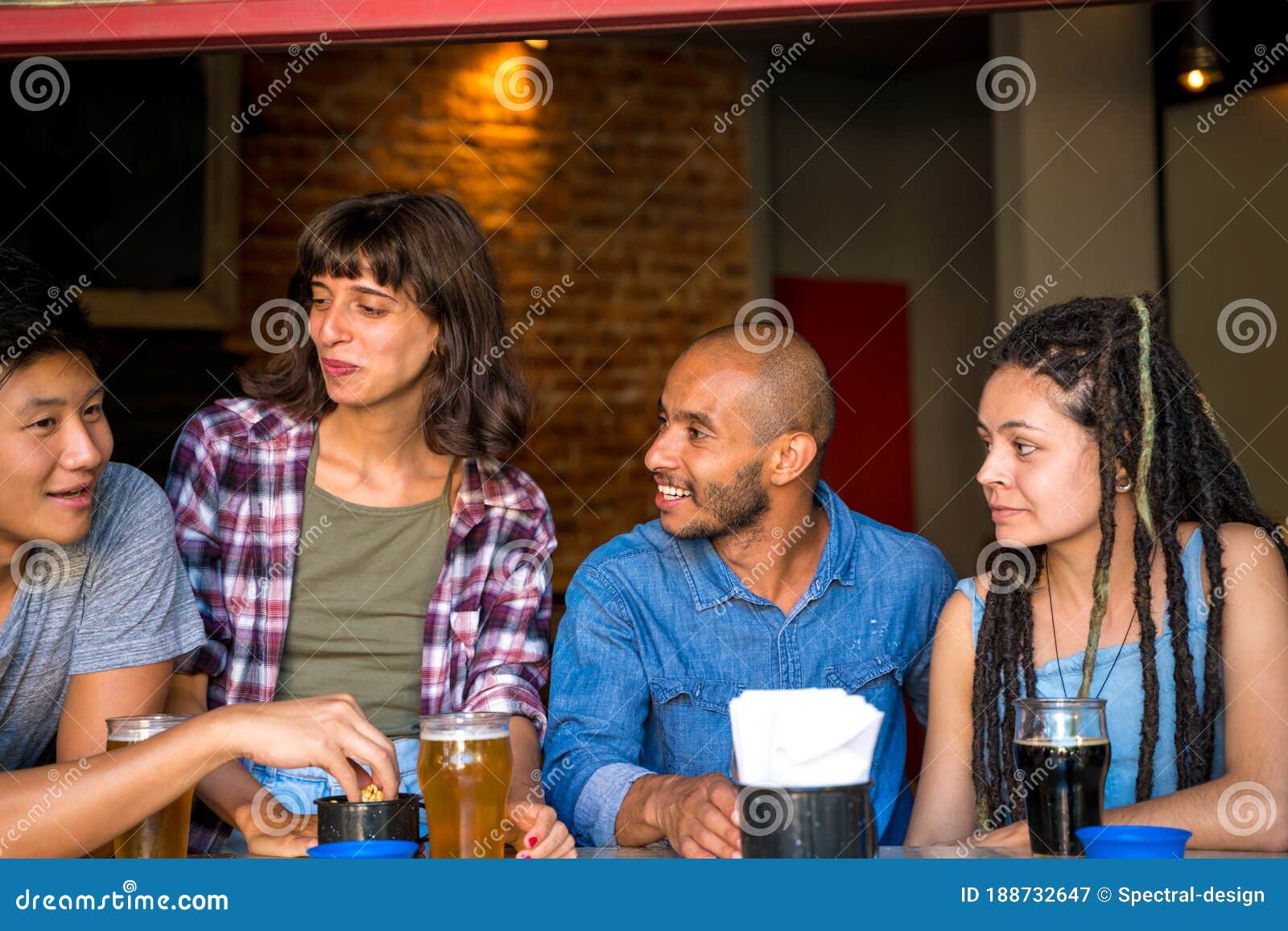 A Group of Friends Together in a Bar Stock Image - Image of enjoyment ...