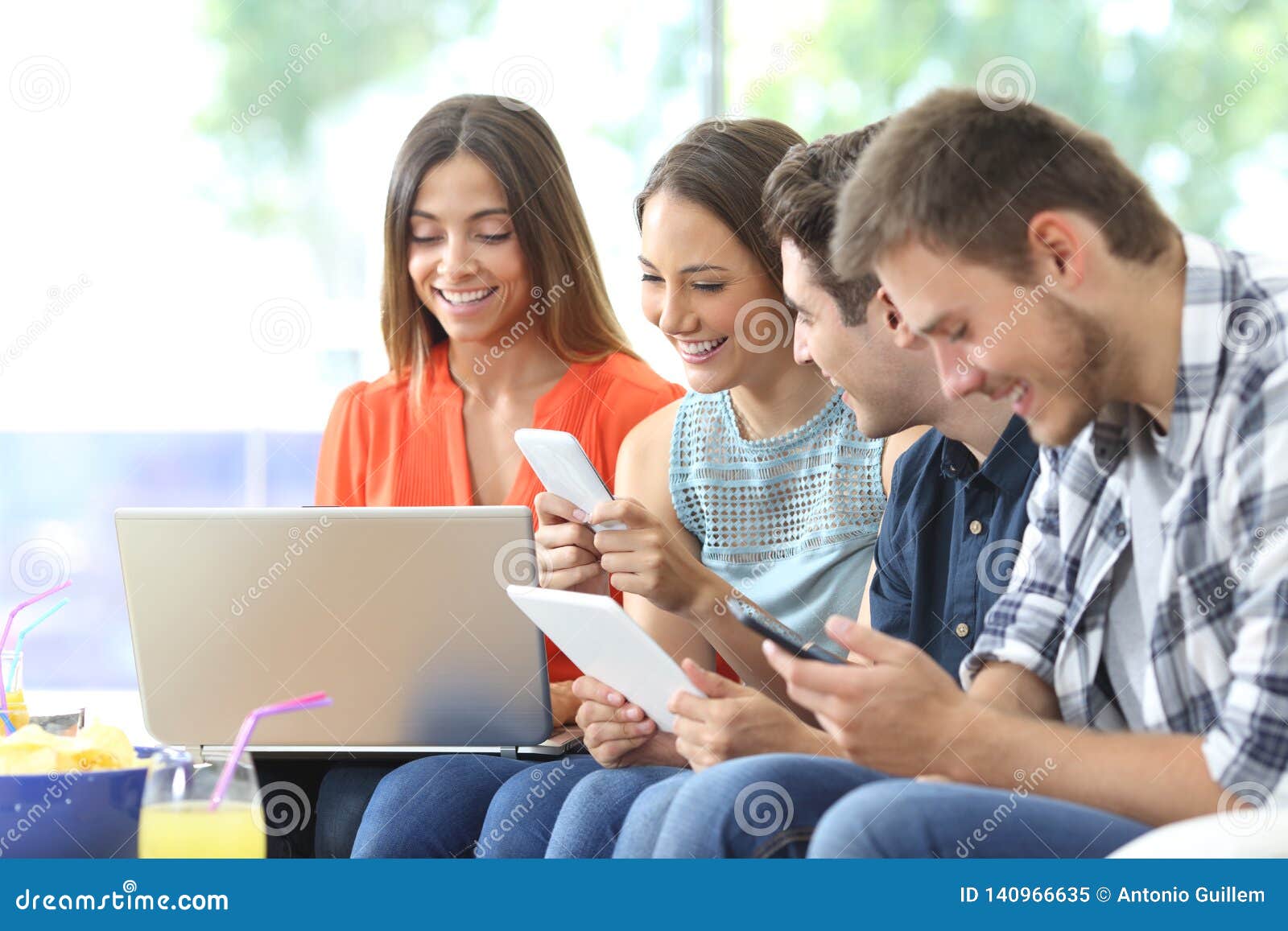 Group of Friends Using Multiple Devices at Home Stock Image - Image of ...