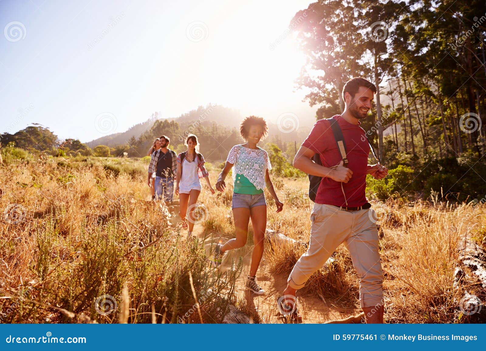 Group of Friends on Walk through Countryside Together Stock Image ...