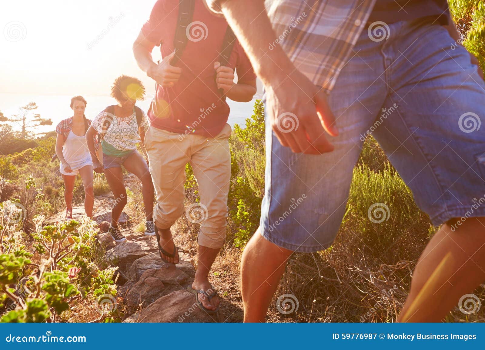 Group of Friends Walking Along Coastal Path Together Stock Image ...