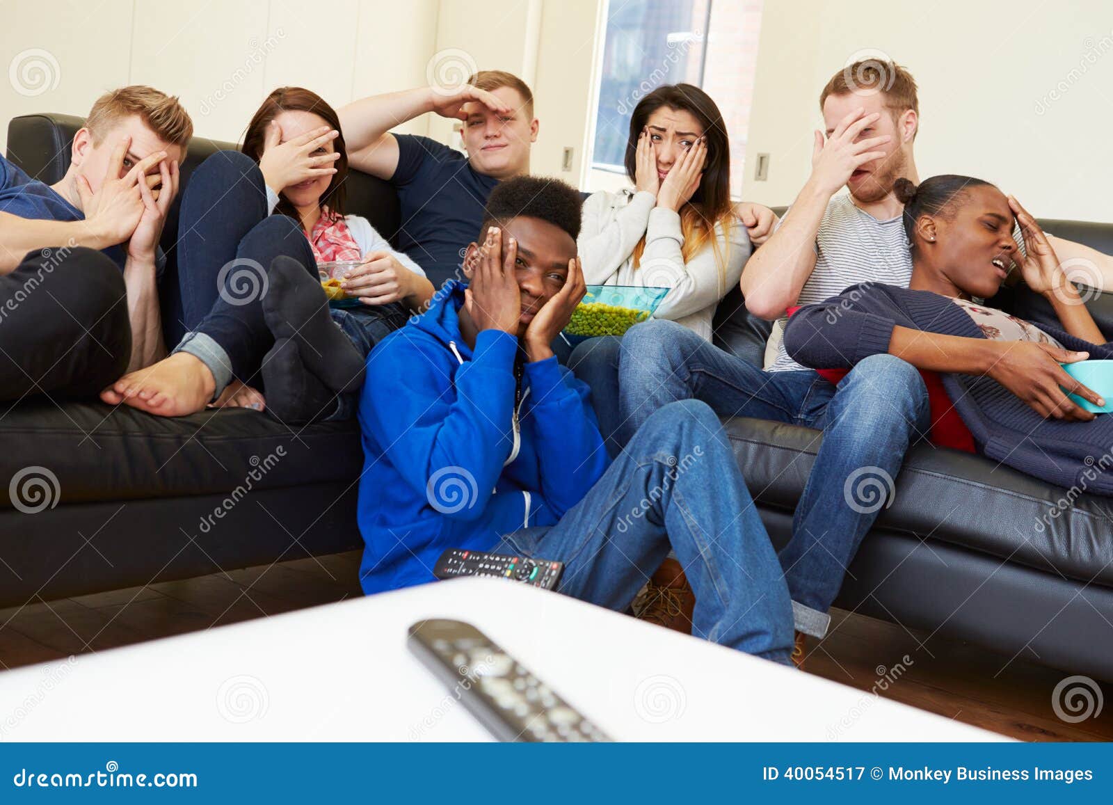 Group of Friends Watching Television at Home Together Stock Image ...