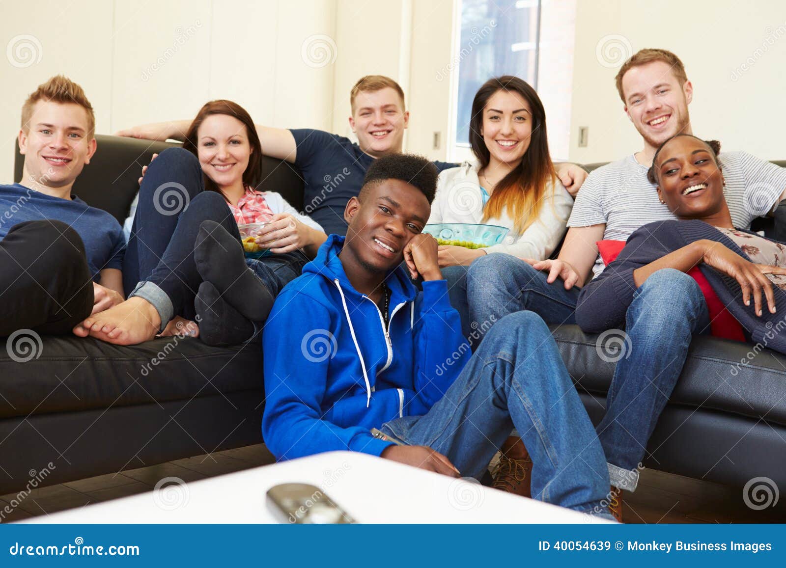 Group of Friends Watching Television at Home Together Stock Image ...