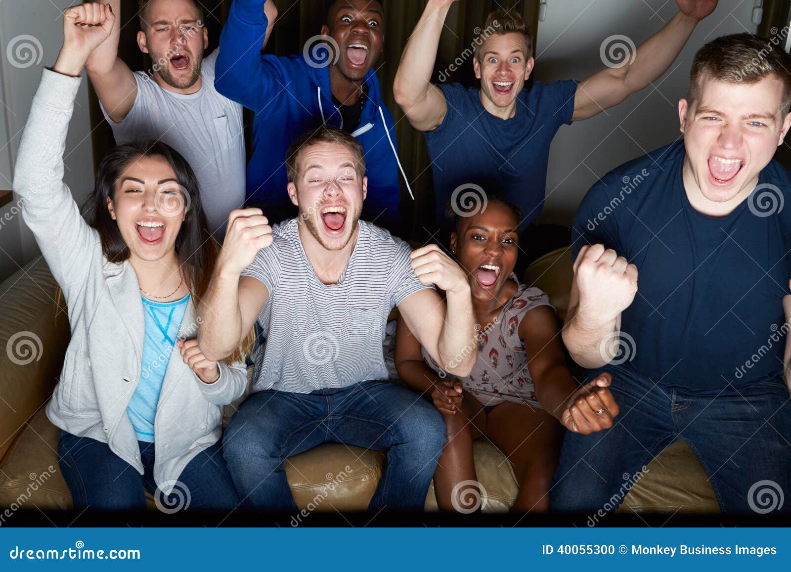 Group of Friends Watching Television at Home Together Stock Photo ...