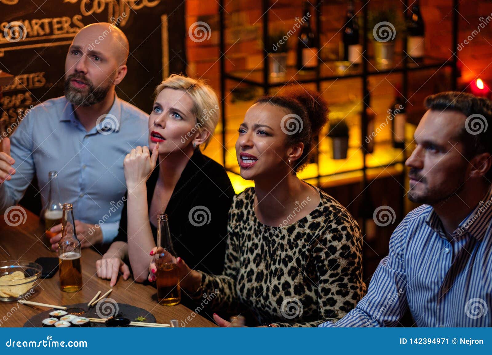 Group of Friends Watching Tv in a Cafe Behind Bar Counter Stock Image ...