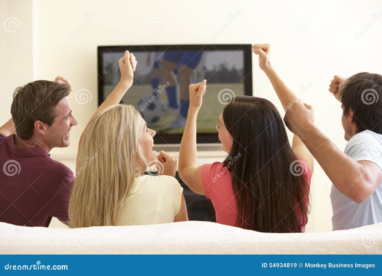 Group of Friends Watching Widescreen TV at Home Stock Image - Image of ...