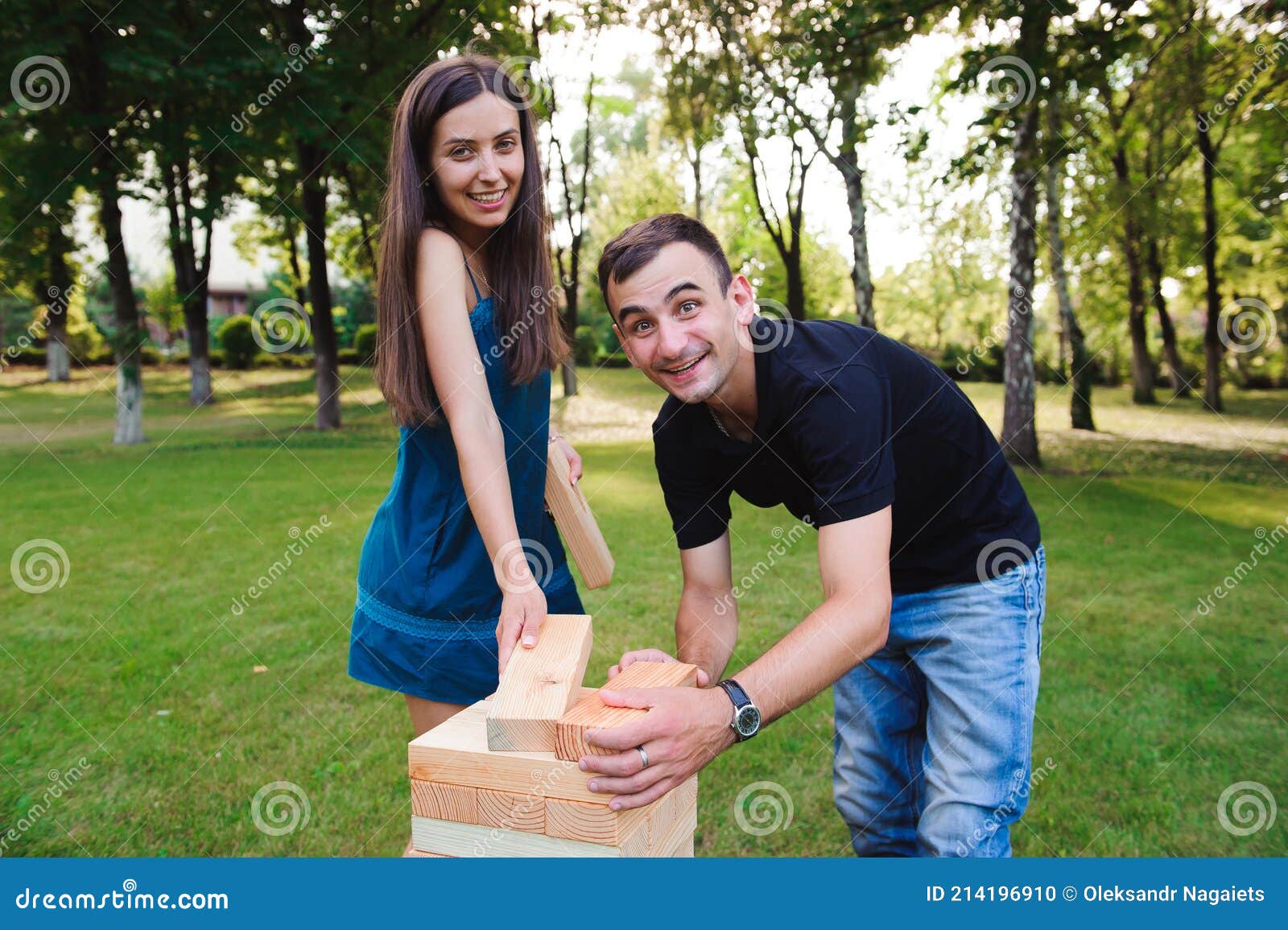 Group Game of Physical Skill with Big Blocks on the Green Grass. Stock ...