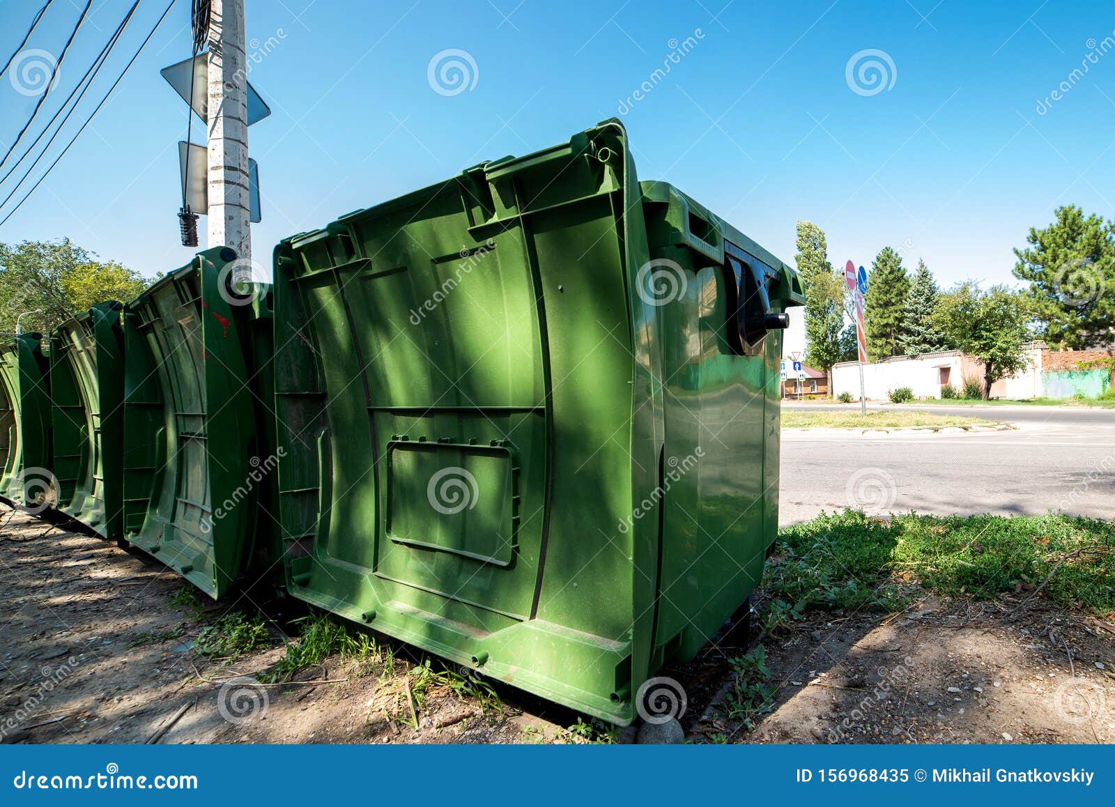 A Group of Garbage Cans on the Side of the Road Stock Image - Image of ...