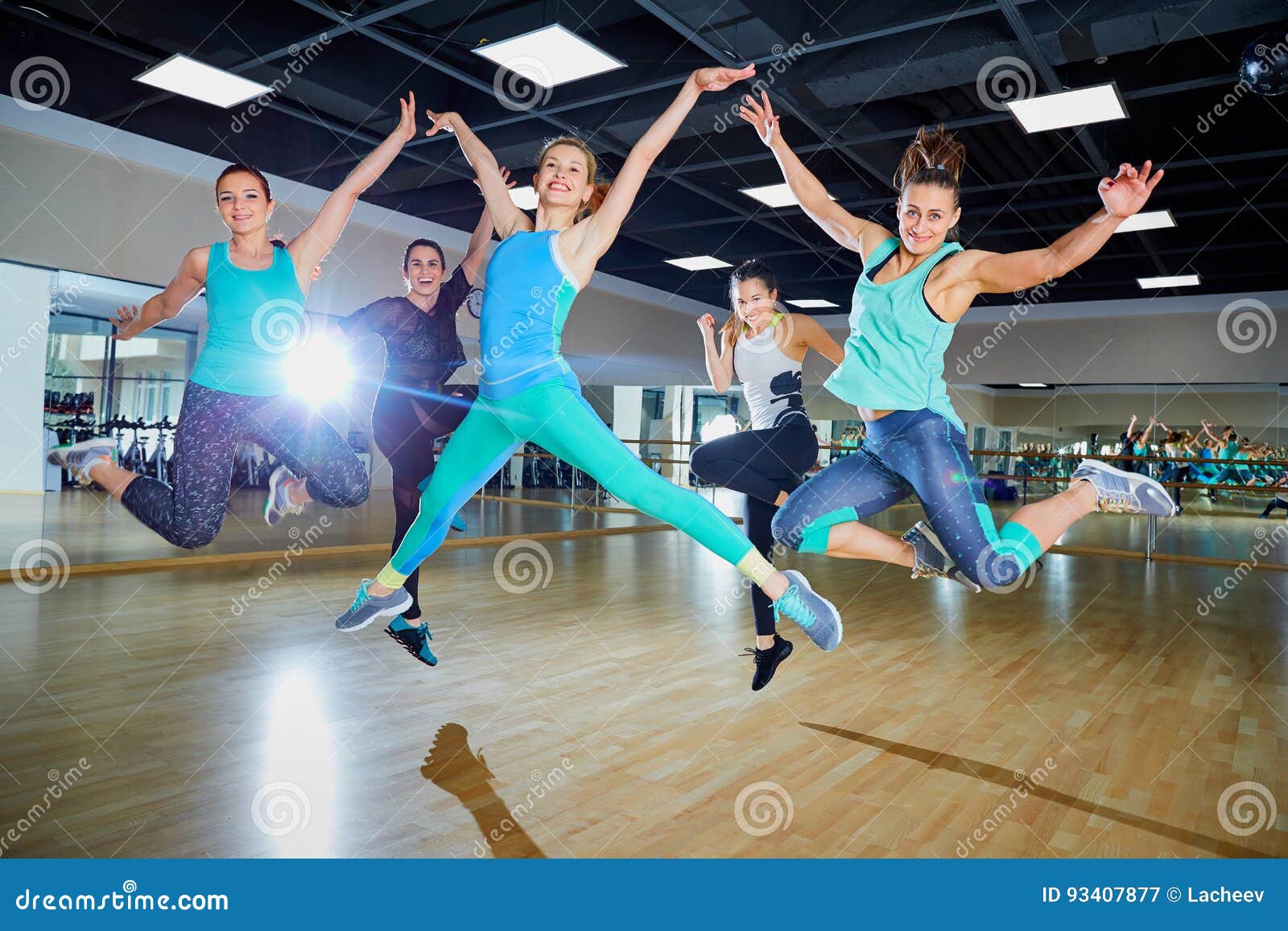 A Group of Girls Jump with Smiles in the Gym Stock Image - Image of ...