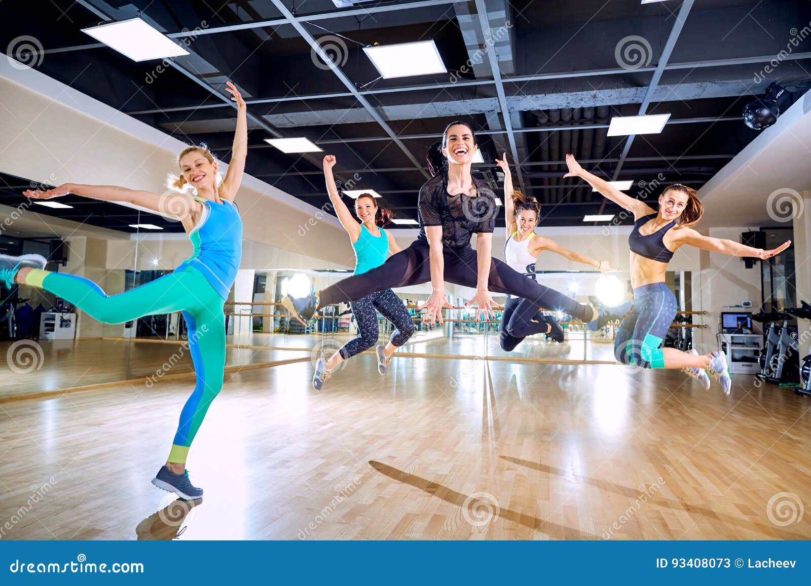 A Group of Girls Jump with Smiles in the Gym Stock Image - Image of ...