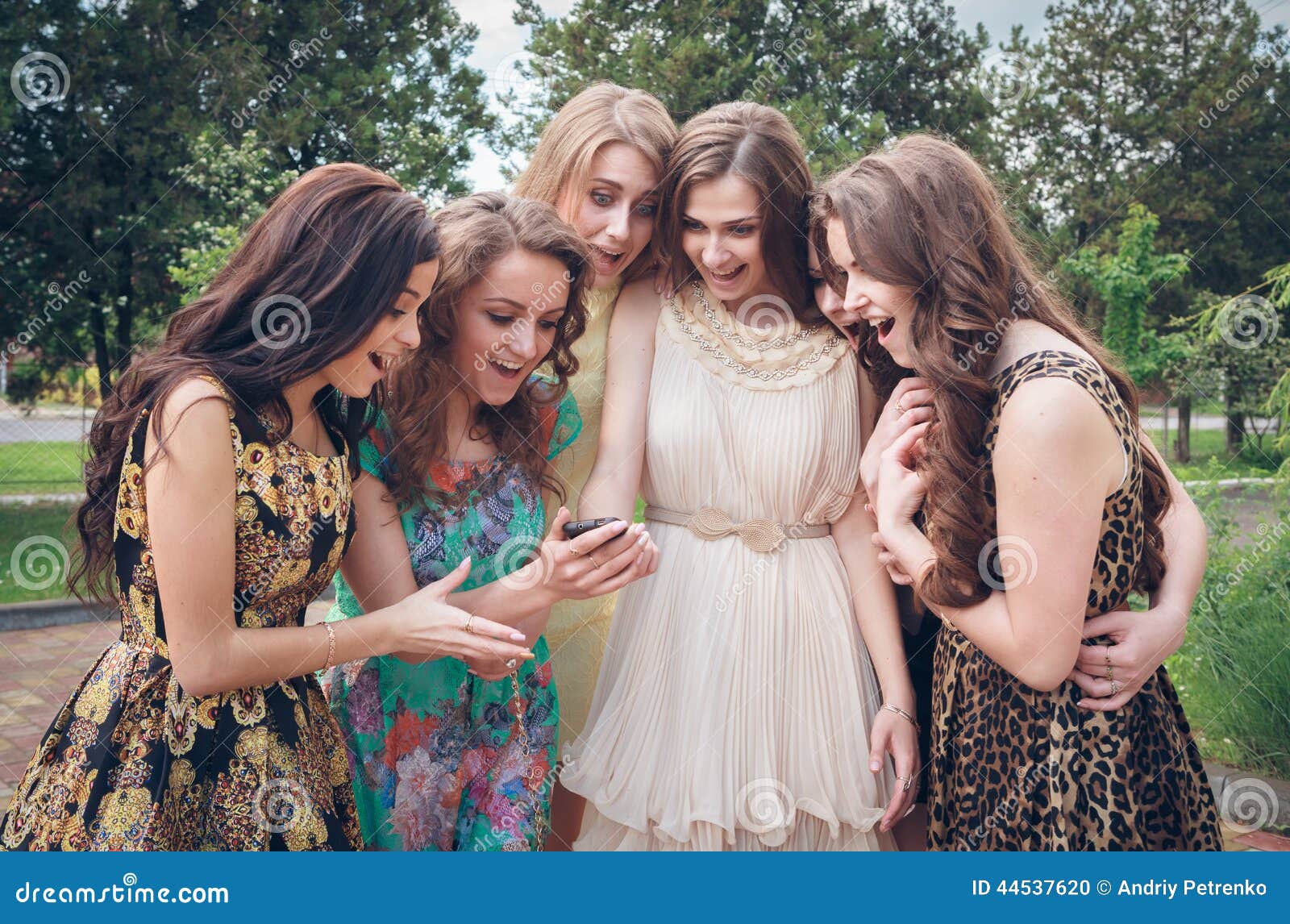Group of Girls Looking at a Cell Phone Stock Photo - Image of happy ...