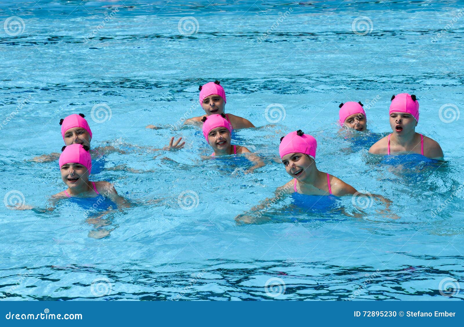 Group of Girls in a Pool Practicing Synchronized Swimming Editorial ...
