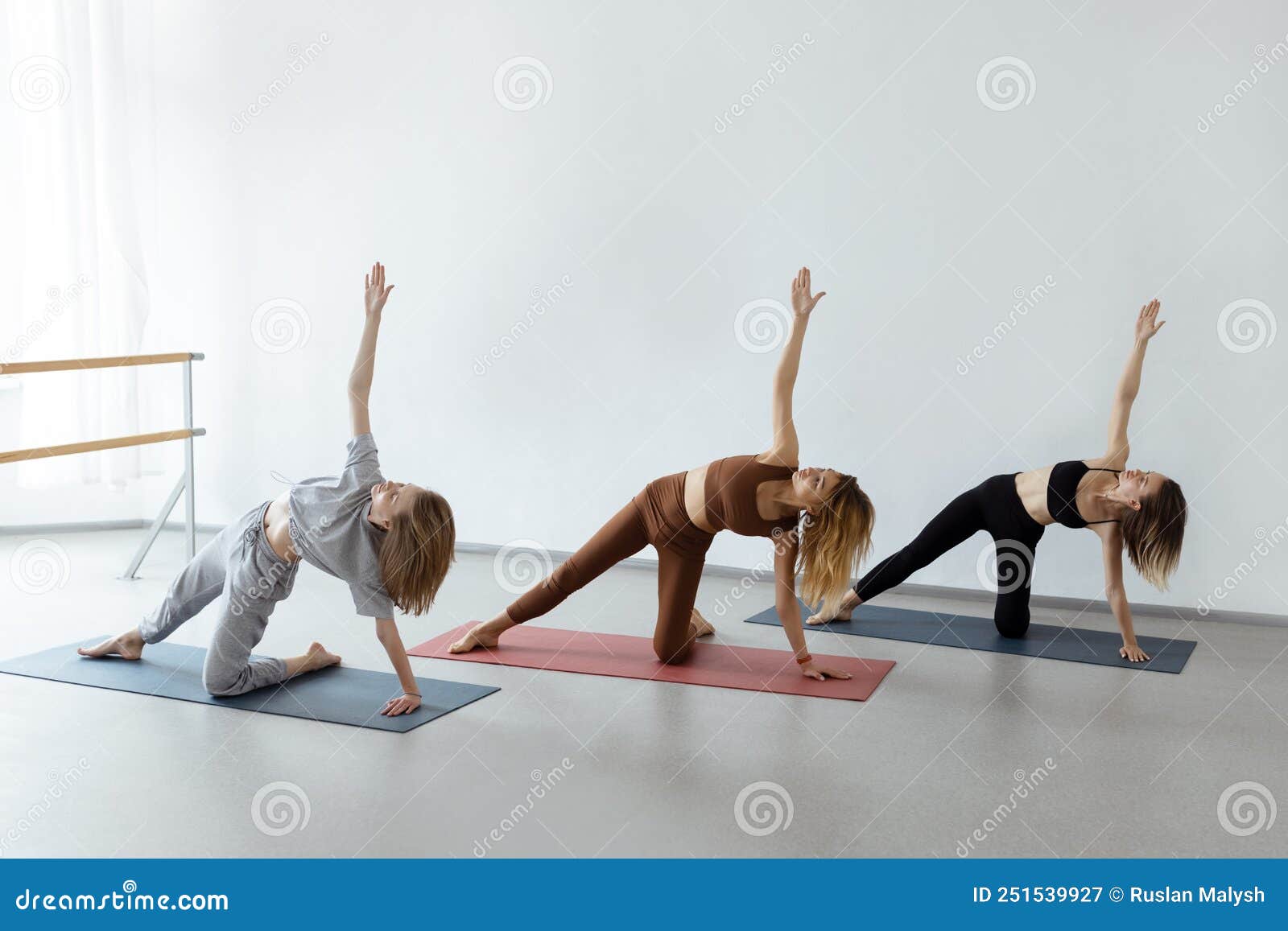 A Group of Girls Practice Yoga Asanas in the Studio.Group Yoga Classes ...