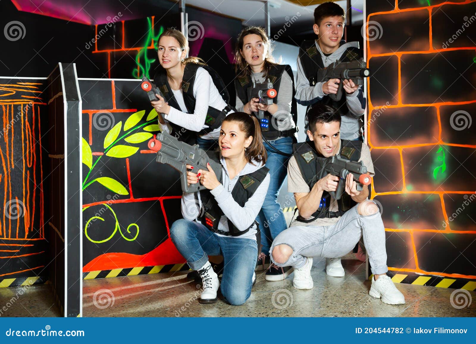 Group Glad People Playing Laser Tag Game Stock Photo - Image of girl ...