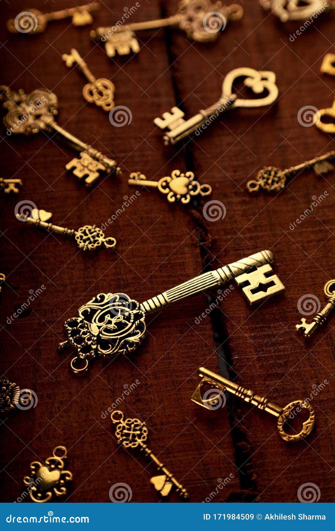 Group of Golden Antique Keys on an Old Wood Background Stock Image ...