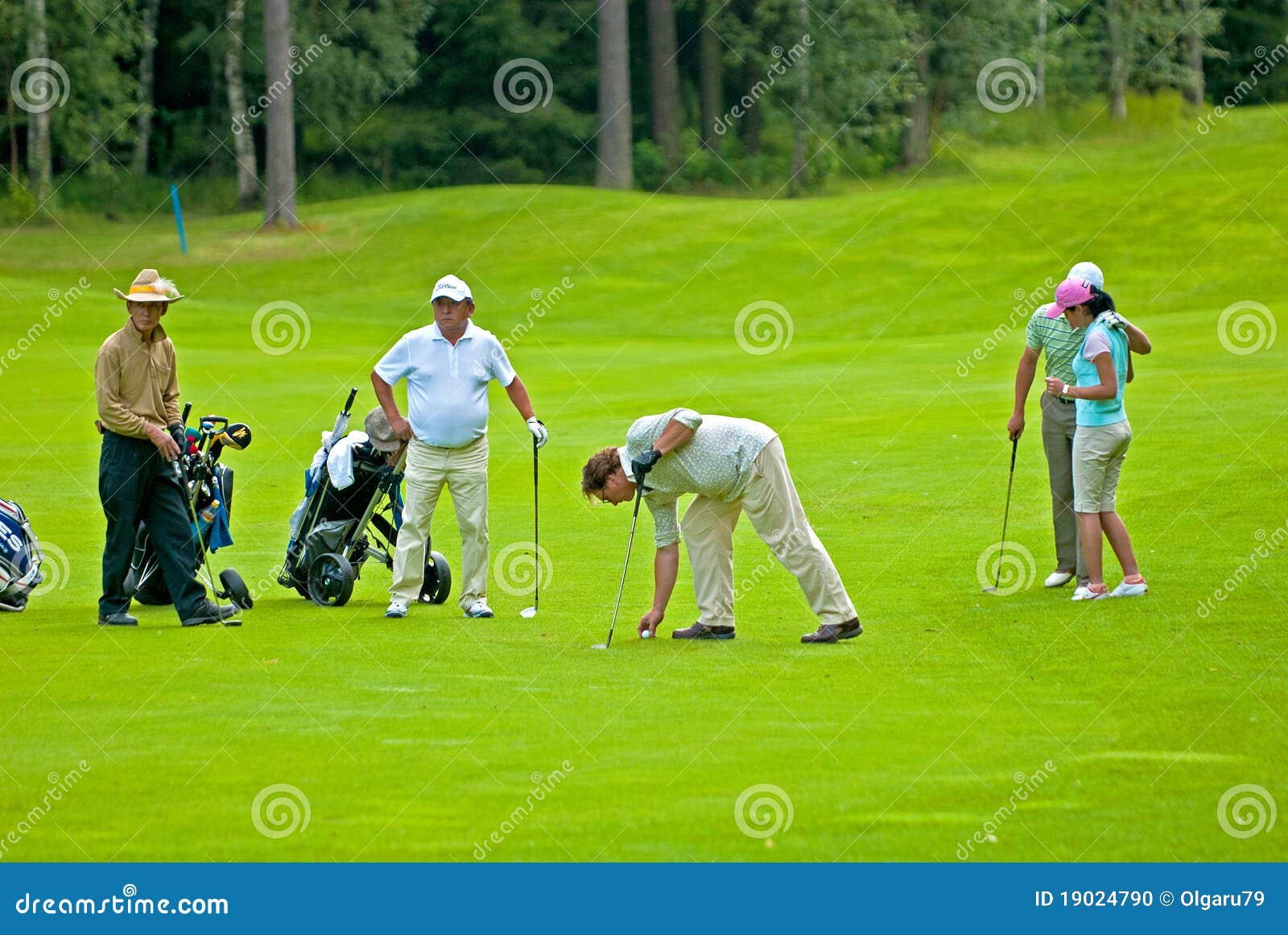 Group Of Golfers Practicing And Training Golf Swing On Driving Range ...