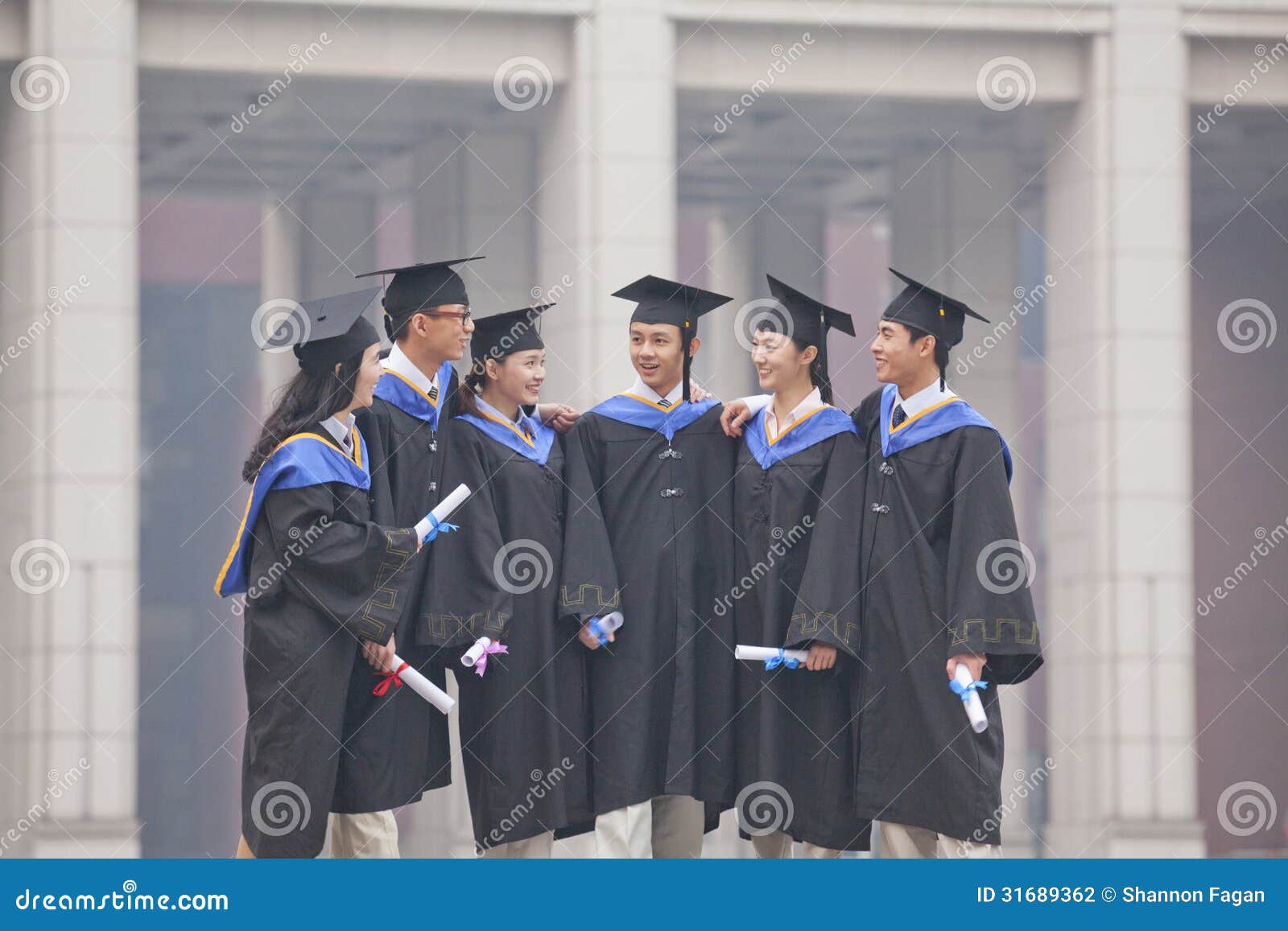 Group of Graduate Students Standing Together with Diplomas Stock Photo ...