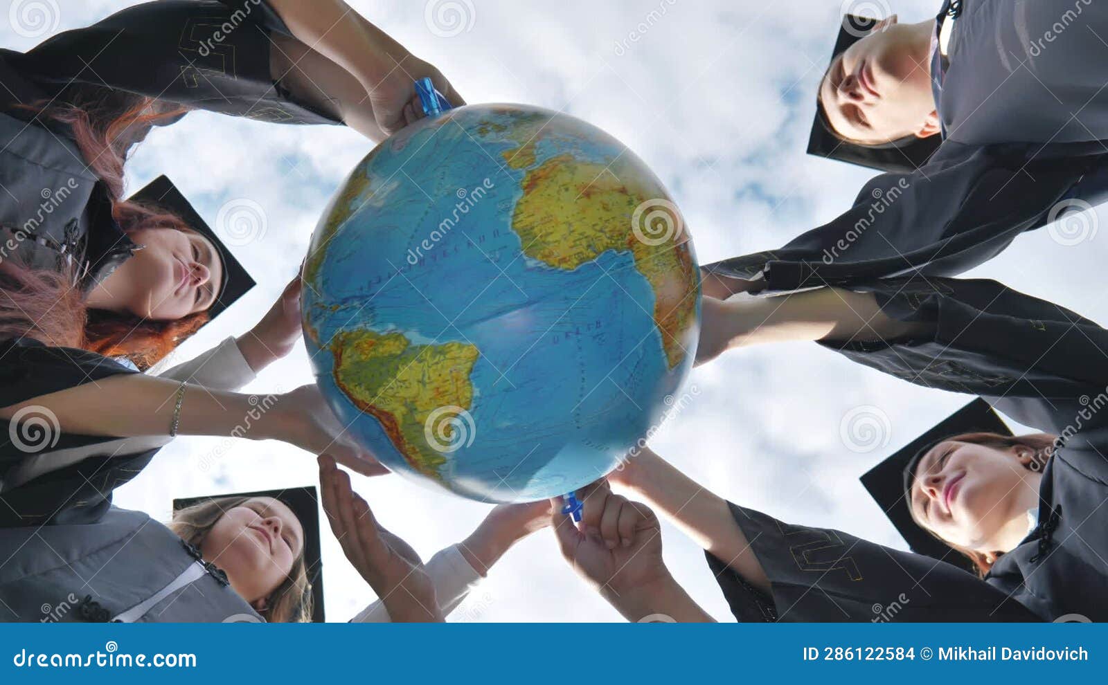 A Group of Graduates Hug a Globe of Peace. the Concept of Preserving ...