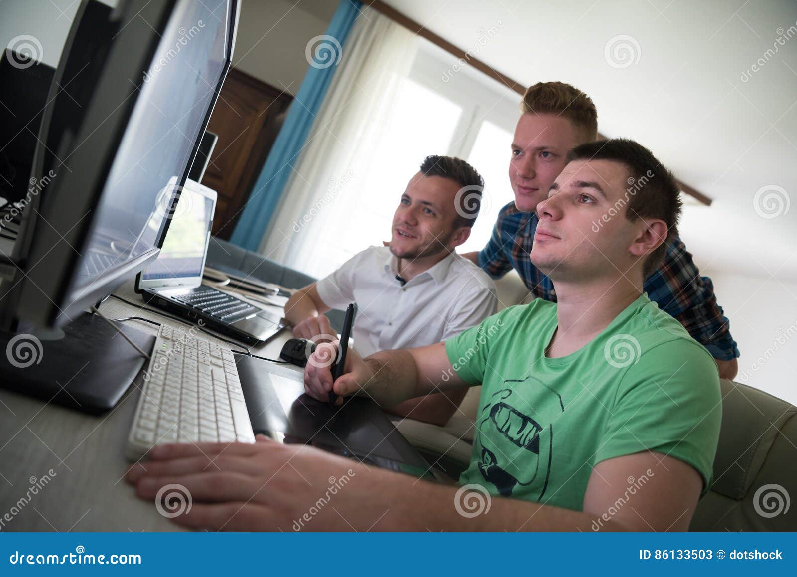 A Group of Graphic Designers at Work Stock Image - Image of responsive ...